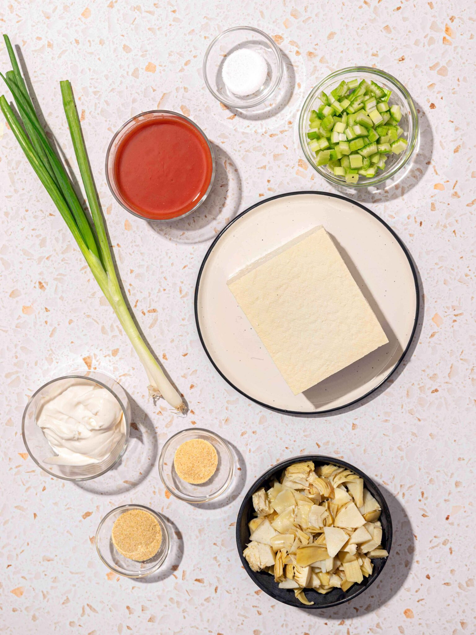 Vegan Baked Buffalo Chicken Dip with Artichokes - Desiree Nielsen