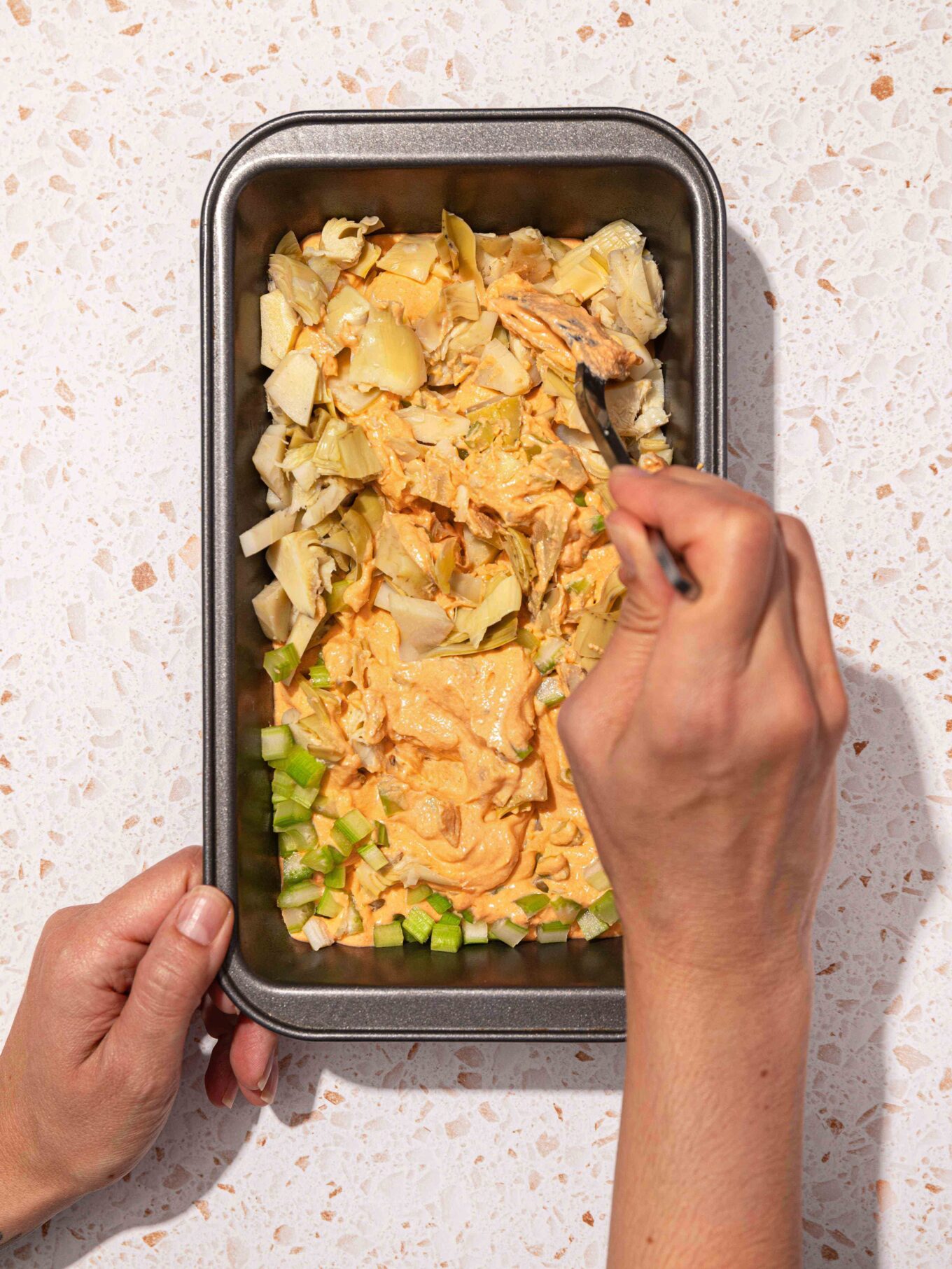 Vegan Baked Buffalo Chicken Dip with Artichokes - Desiree Nielsen