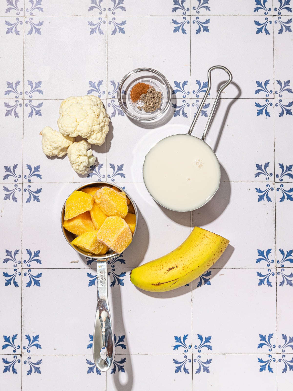 Quick Mango Cardamom Smoothie with Cauliflower - Desiree Nielsen